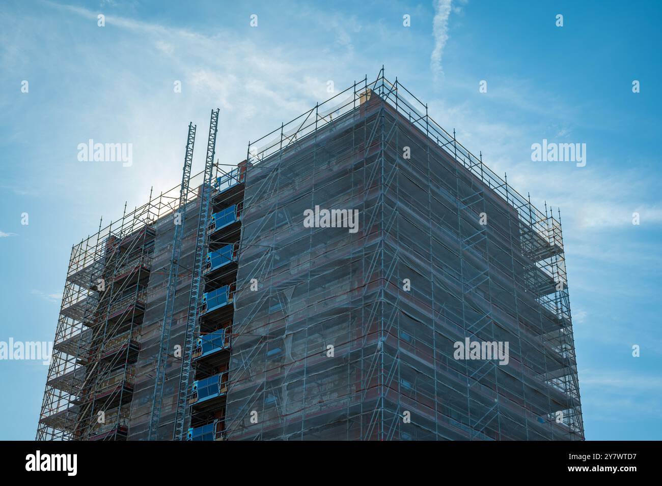 Scaffold sheeting net wrapped apartments building during insulation in ...