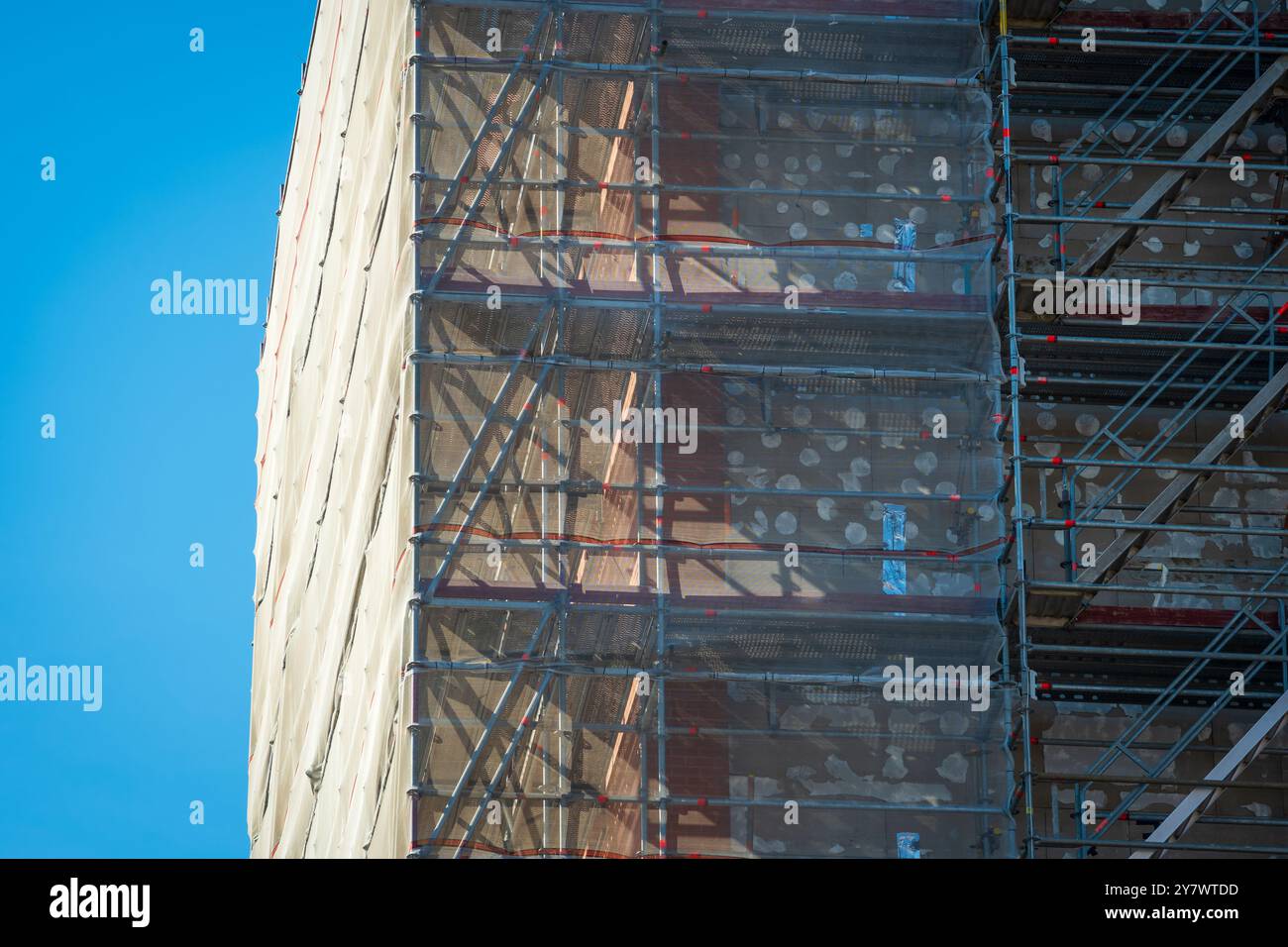 Scaffold sheeting net wrapped apartments building during insulation in ...