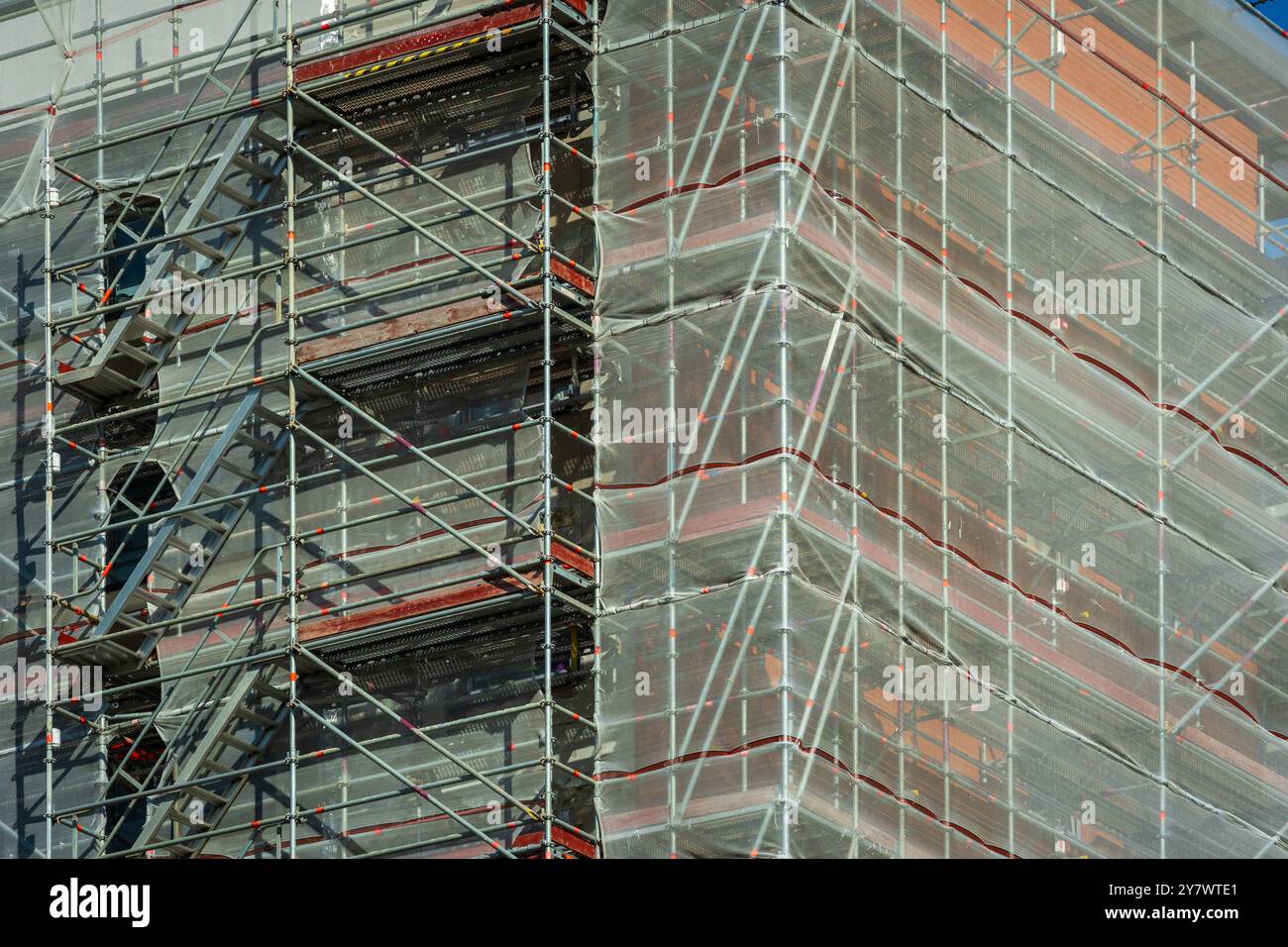 Scaffold sheeting net wrapped apartments building during insulation in ...