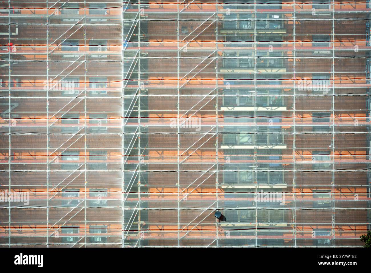 Scaffold sheeting net wrapped apartments building during insulation in ...