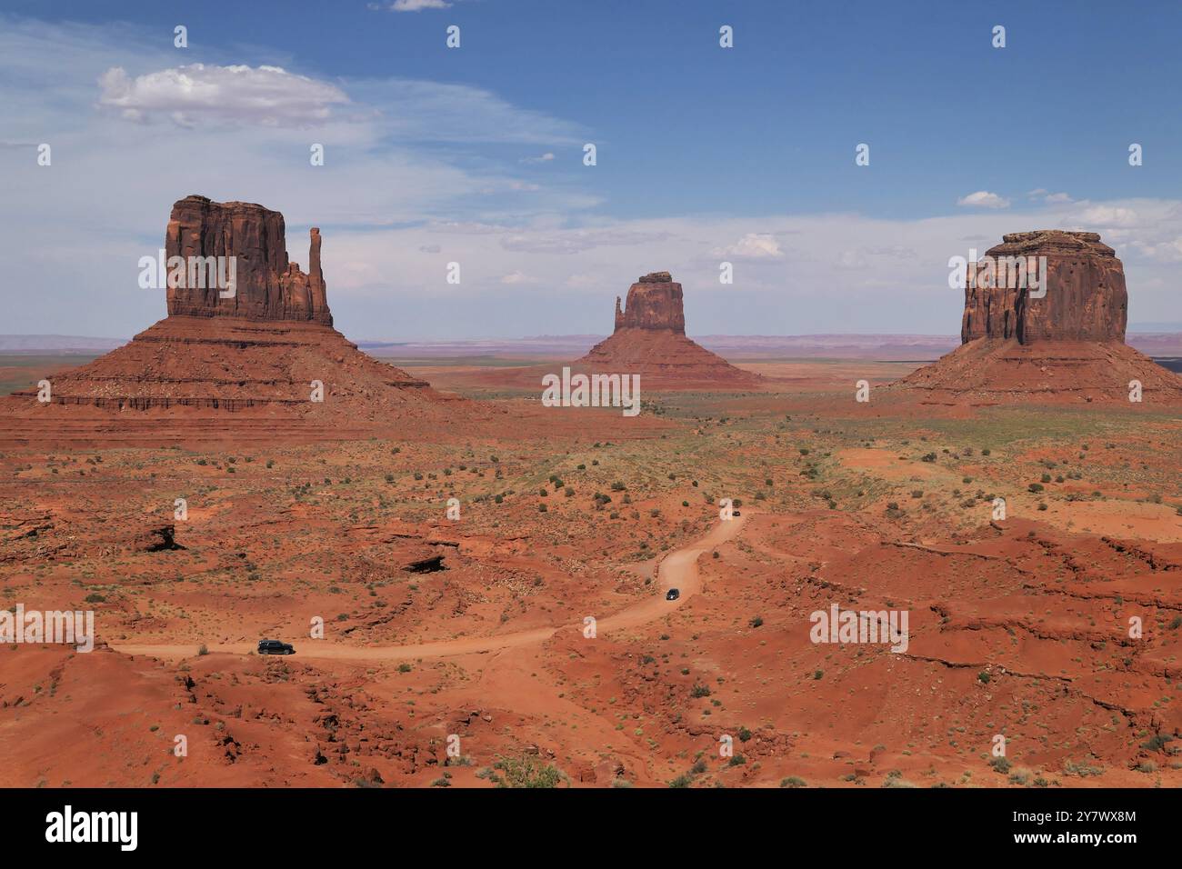 Iconic, towering red sandstone buttes and mesas rise dramatically from ...