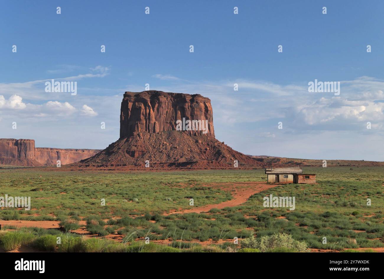 Iconic, towering red sandstone buttes and mesas rise dramatically from ...