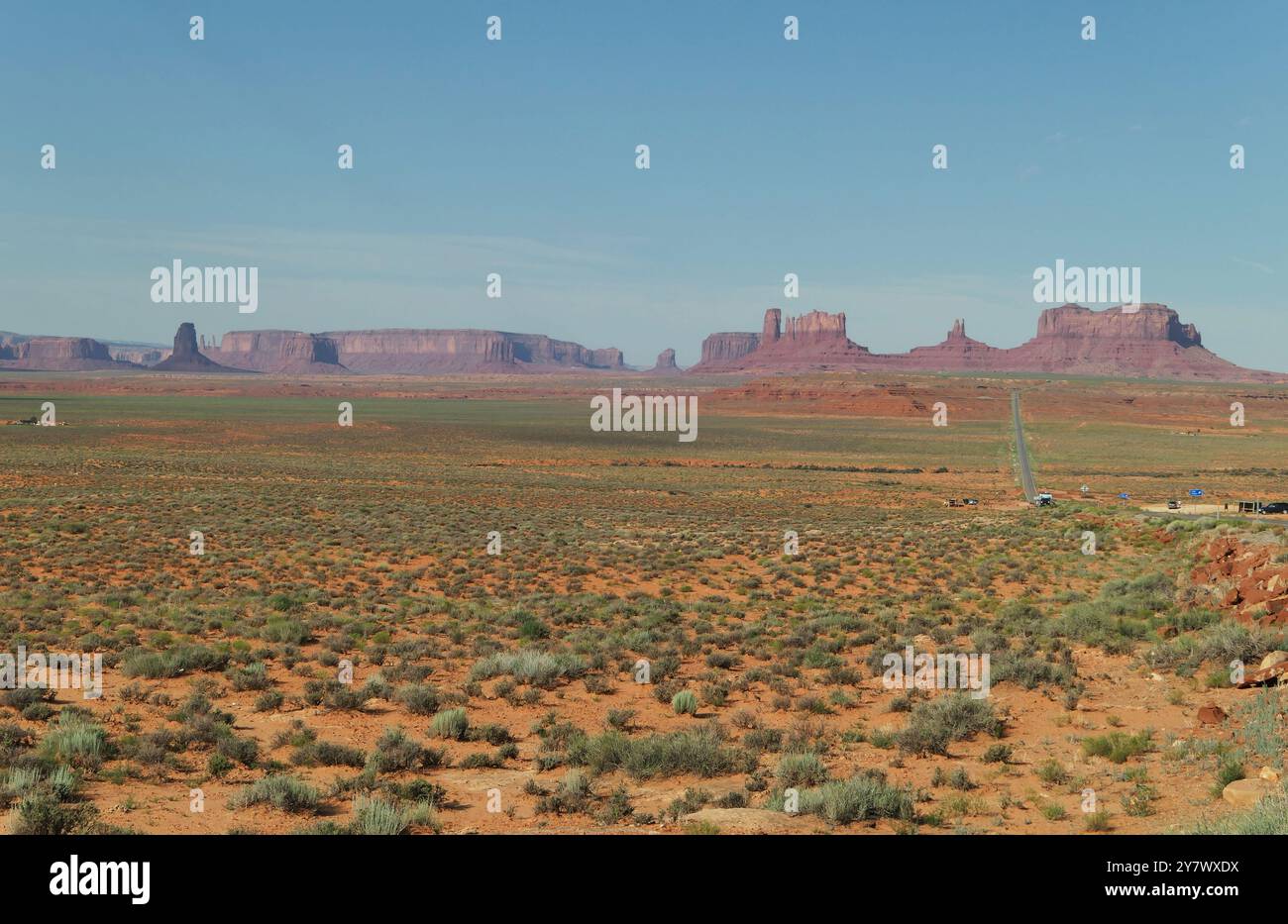 Iconic, towering red sandstone buttes and mesas rise dramatically from ...