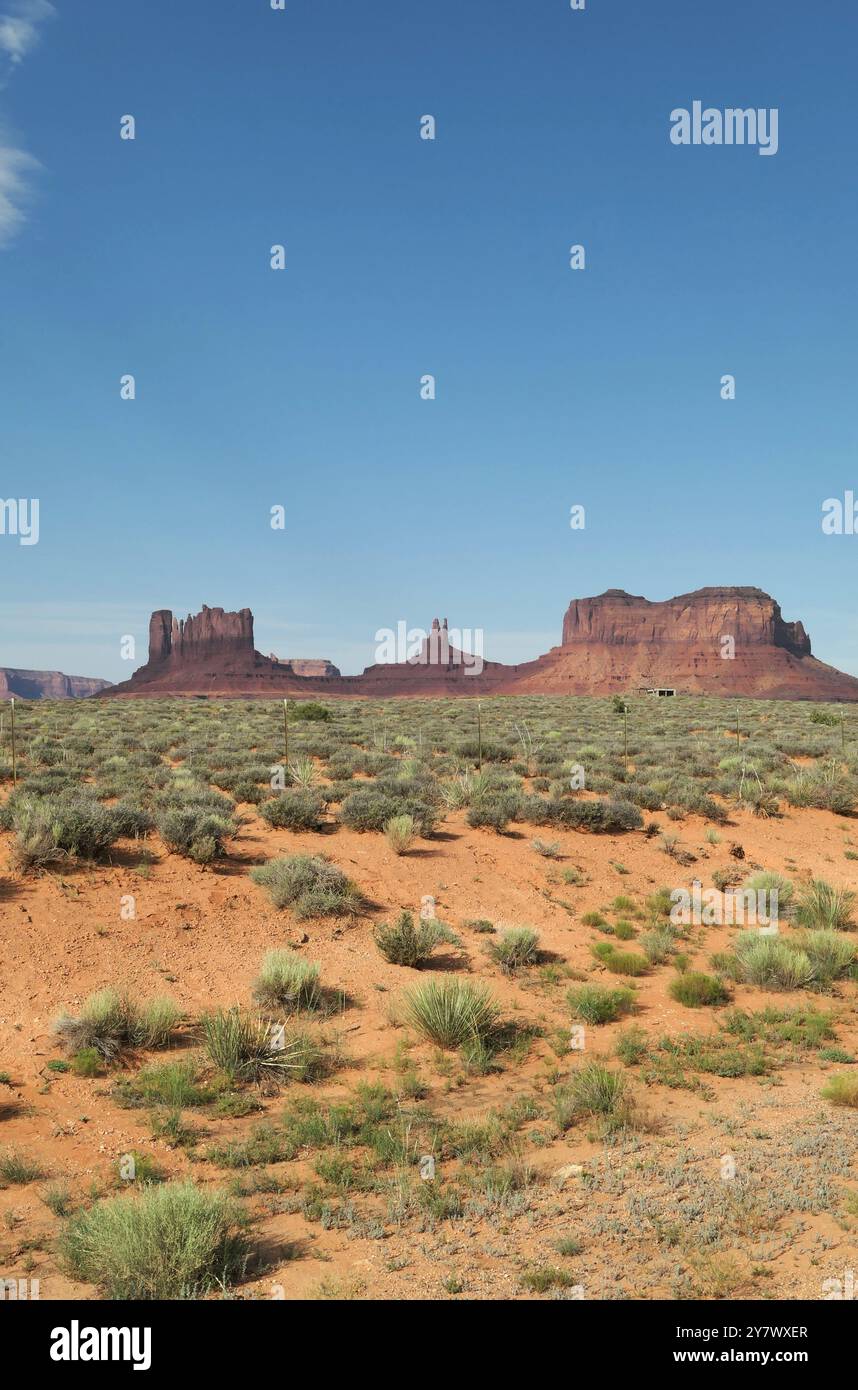 Iconic, towering red sandstone buttes and mesas rise dramatically from ...