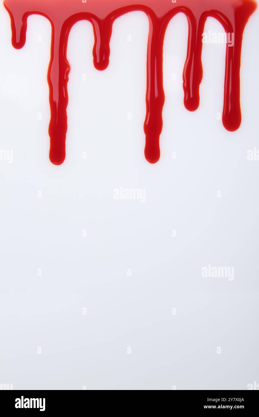 Leaking red blood stain on white background Stock Photo - Alamy