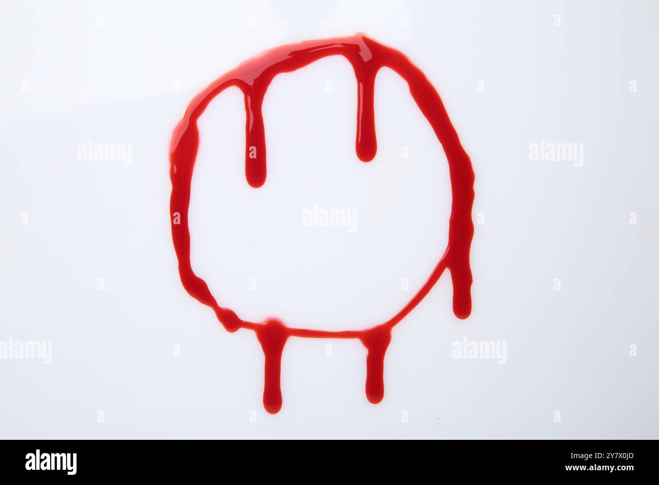 Leaking red blood stain on white background Stock Photo - Alamy