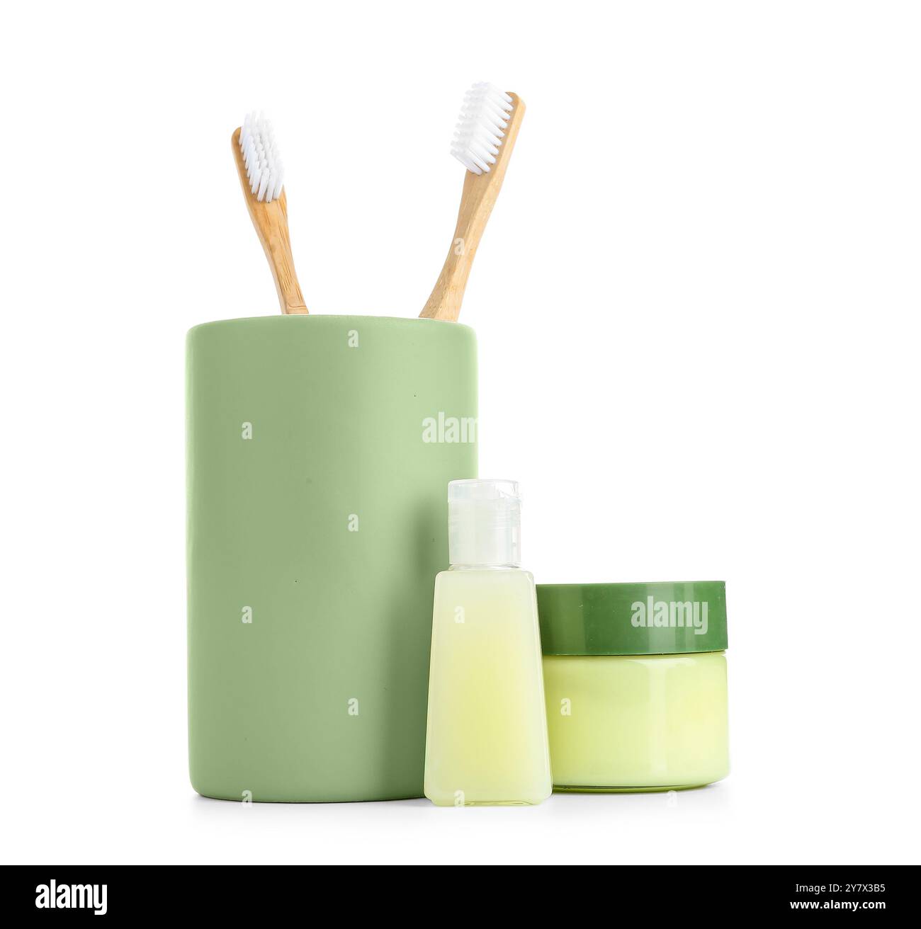 Toothbrush with jars of cream on white background Stock Photo - Alamy