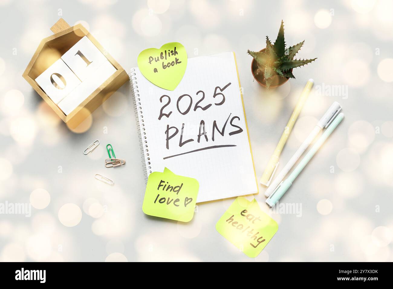 Notebook with to do plans for 2025 year, sticky notes and calendar on ...