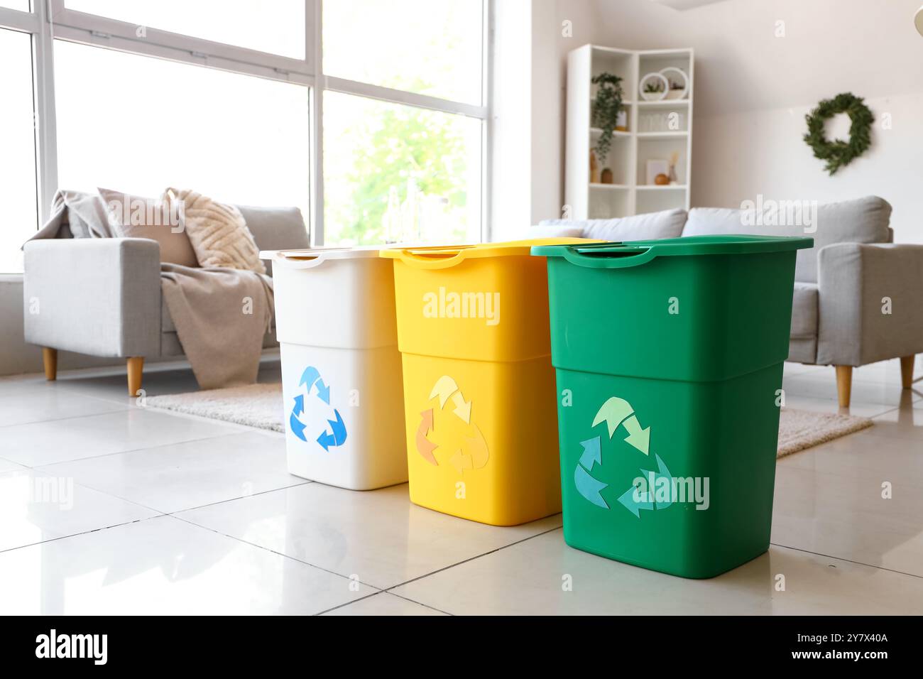 Recycle trash bins in living room Stock Photo - Alamy