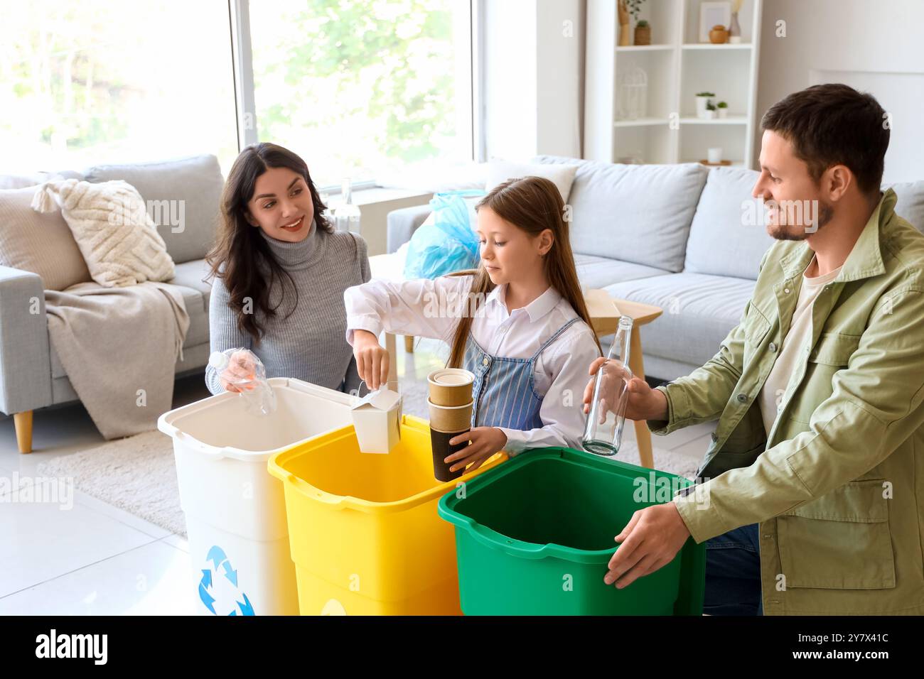 Family sorting garbage in recycle bins at home Stock Photo - Alamy