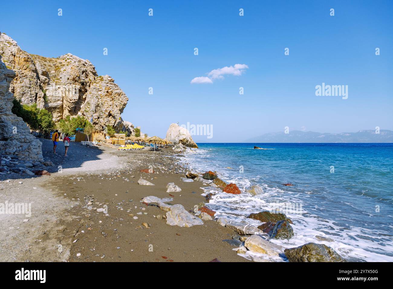 Sand and pebble beach Embros Thermes Beach on the island of Kos in ...