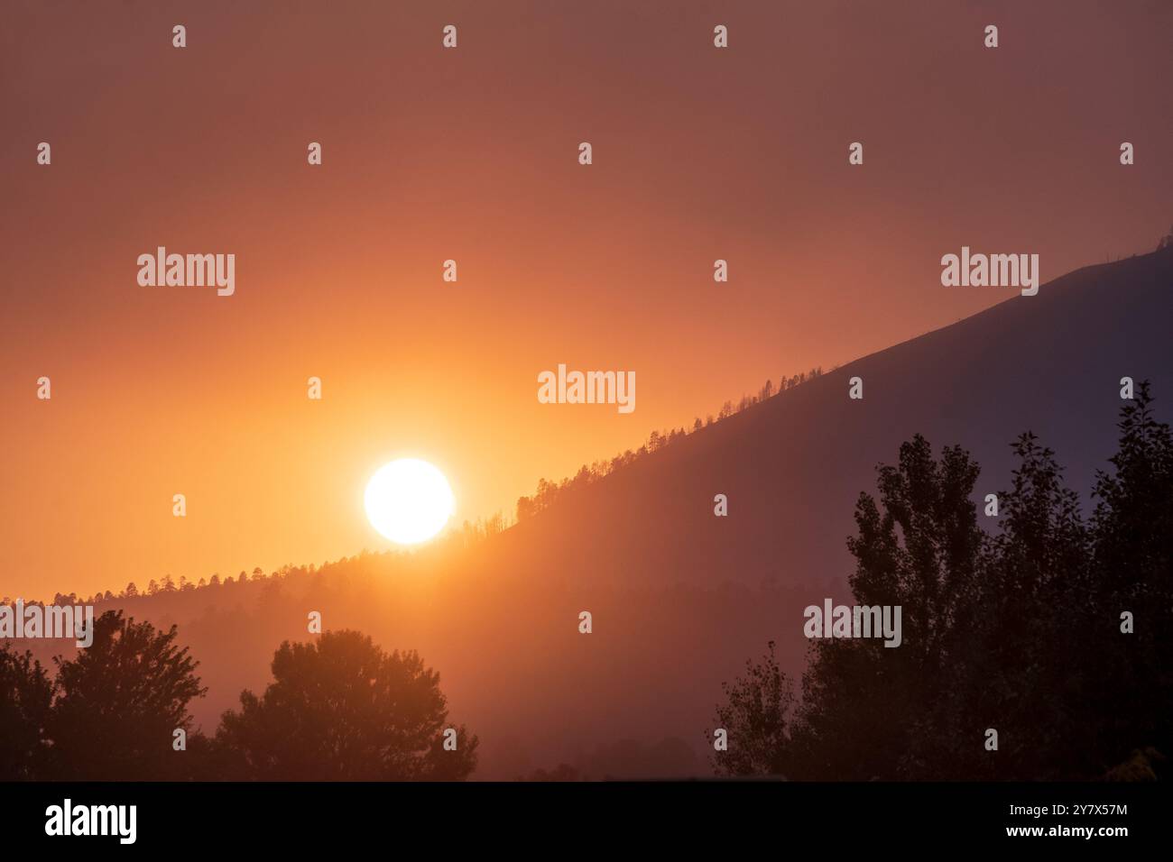 Smoke from a wildfire at sunset in the San Francisco Peaks, Coconino ...