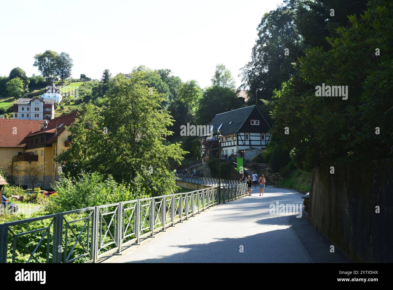 View of pedestrian bridge in village Stock Photo - Alamy