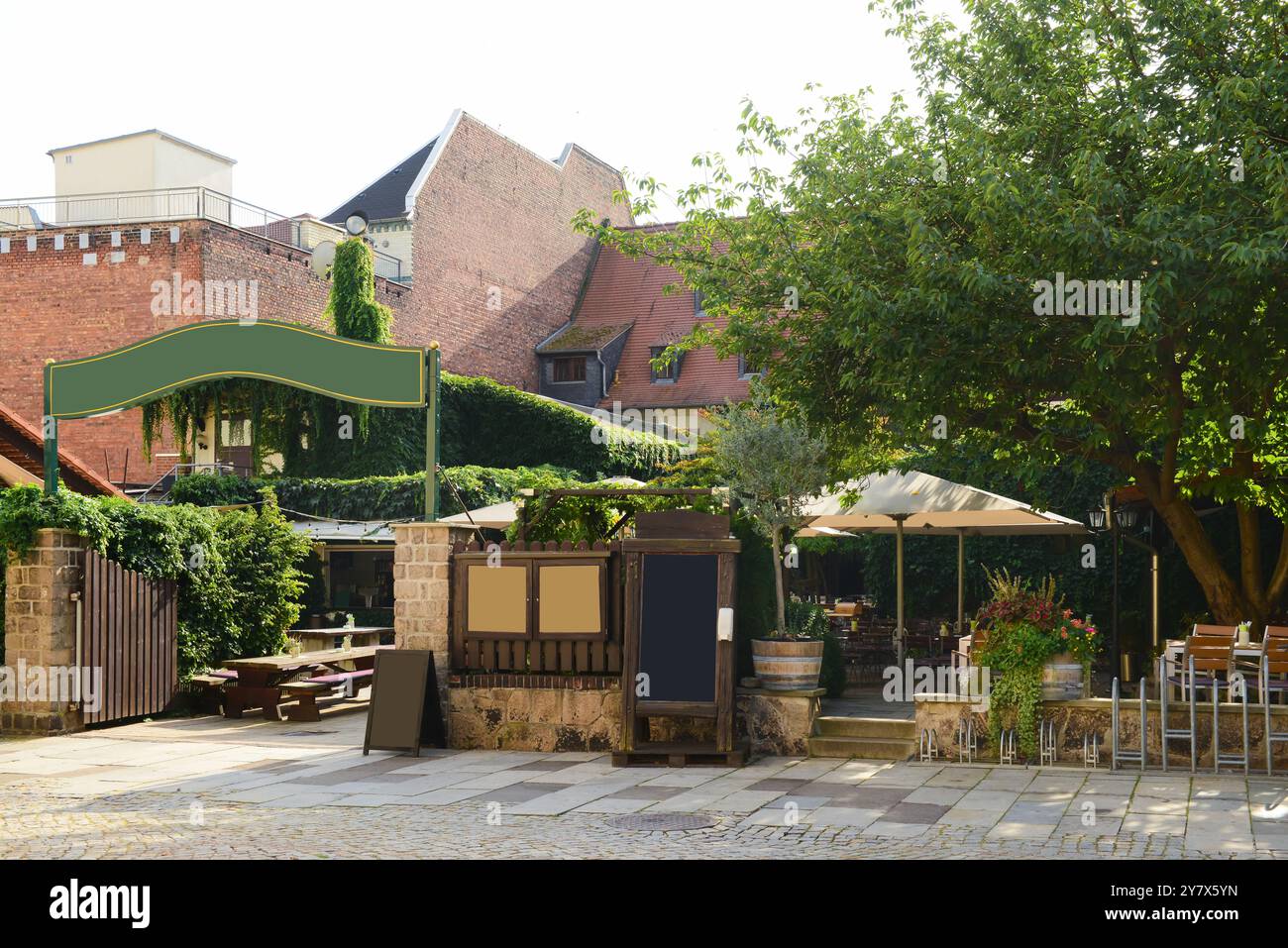 View of German cafe terrace on city street Stock Photo - Alamy
