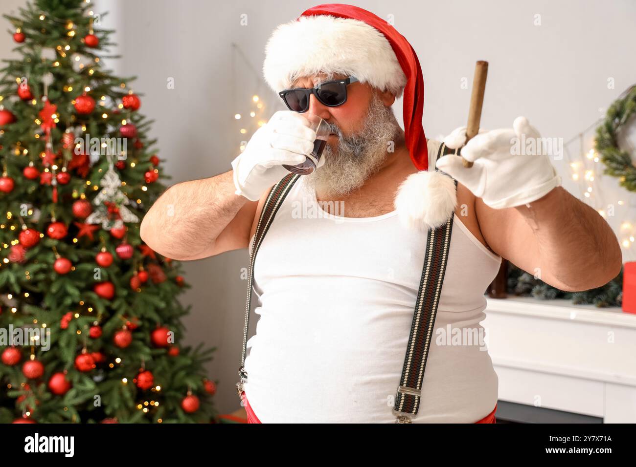 Bad Santa Claus with cigar drinking whiskey at Christmas party Stock ...