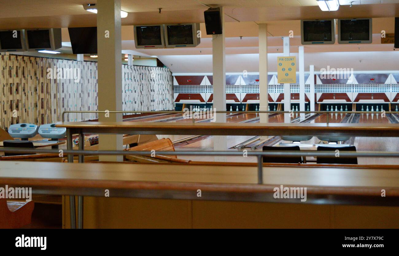 90s-style bowling alley featuring retro decor, wooden lanes, bowling ...