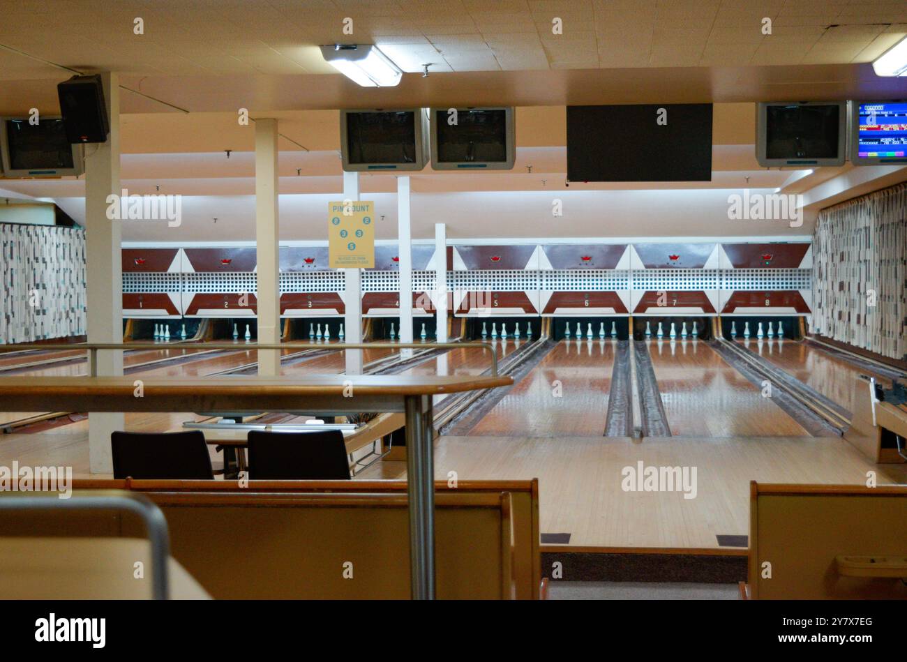 90s-style bowling alley featuring retro decor, wooden lanes, bowling ...