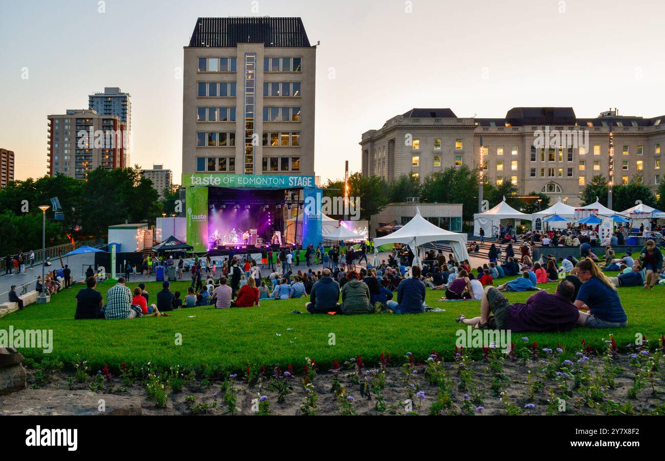Festival in a park featuring a stage for performances, surrounded by ...