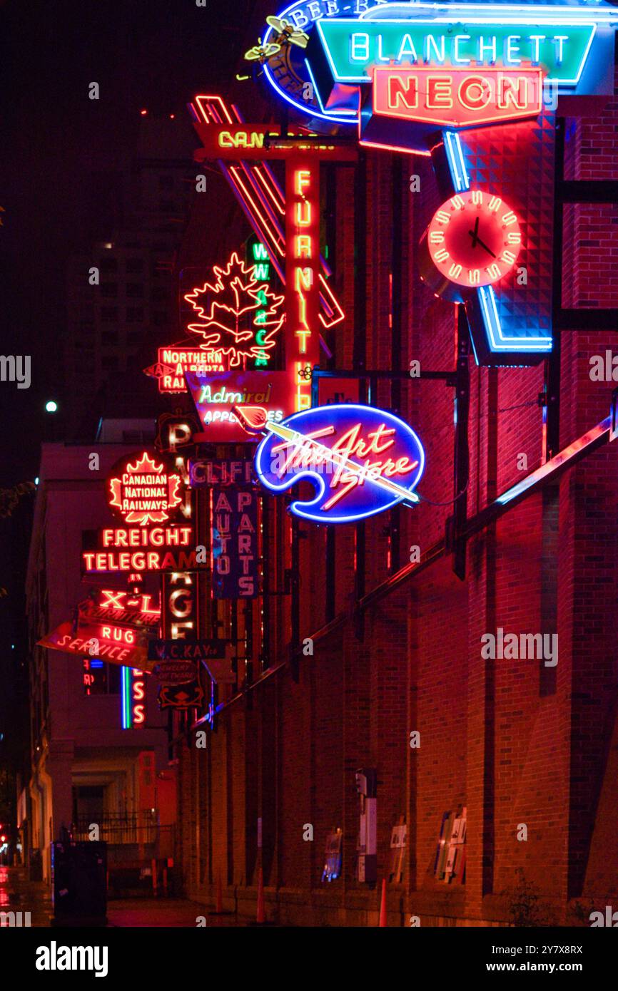 Neon light signs illuminating the street, creating a vibrant and ...