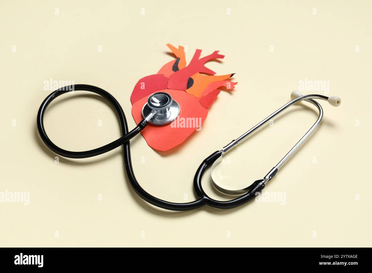 Paper human heart and stethoscope on beige background Stock Photo - Alamy