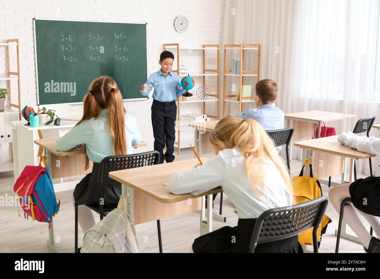 Group of children during lesson in classroom Stock Photo - Alamy