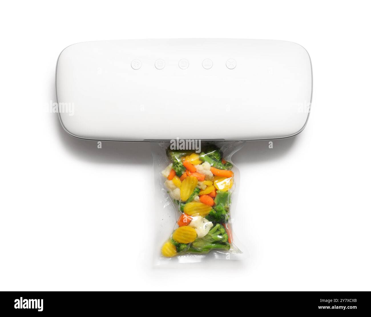 Vacuum sealer machine for food with chopped vegetables in pack on white ...