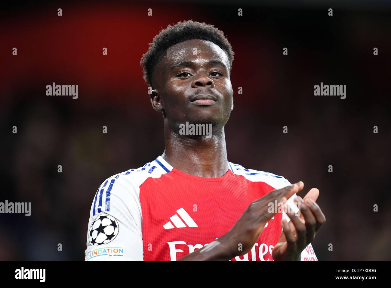 Arsenal's Bukayo Saka applauds the fans during the UEFA Champions ...