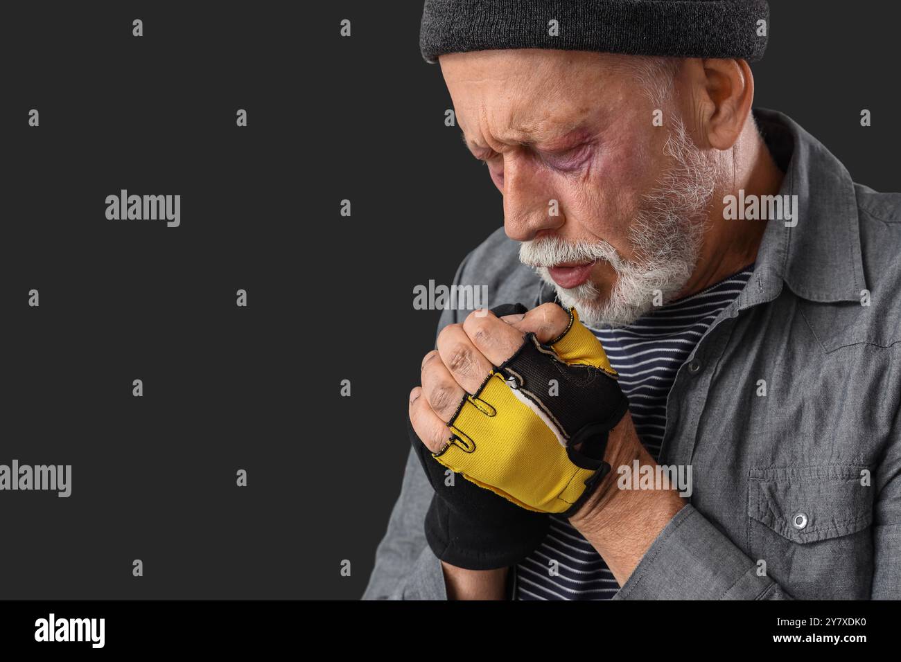 Frozen homeless man on dark background, closeup Stock Photo - Alamy
