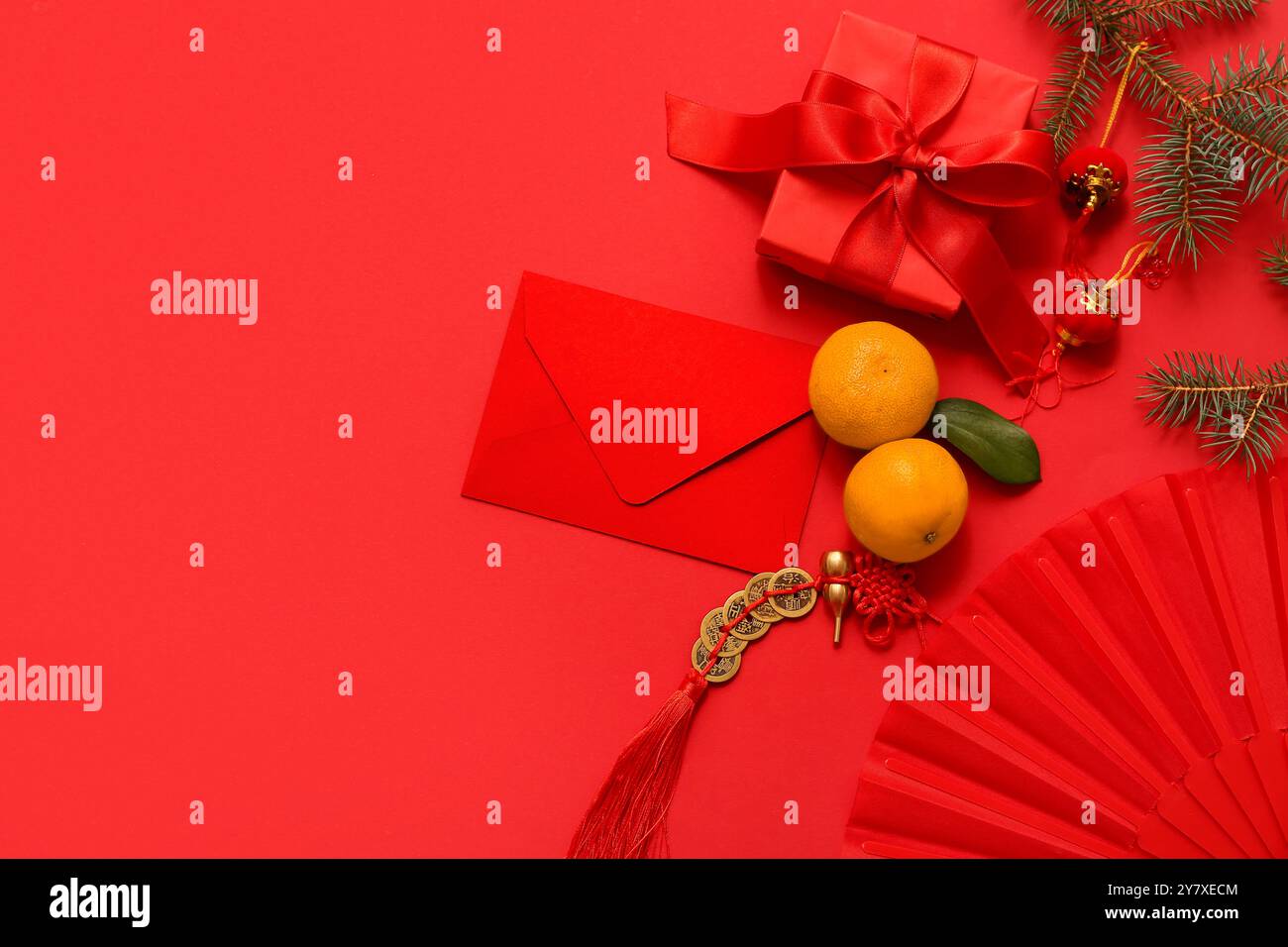 Composition with envelope, tangerines, gift box and oriental symbols on ...
