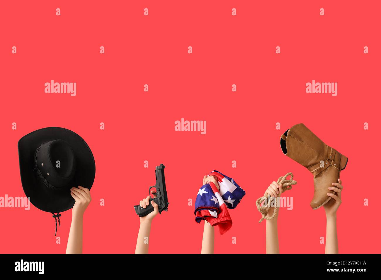 Female hands with cowboy accessories, gun and flag of USA on red ...