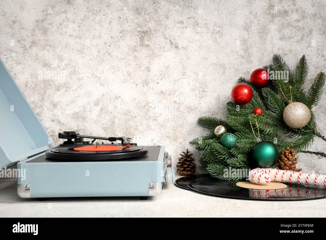 Vinyl record player with disc, fir branches and Christmas balls on ...