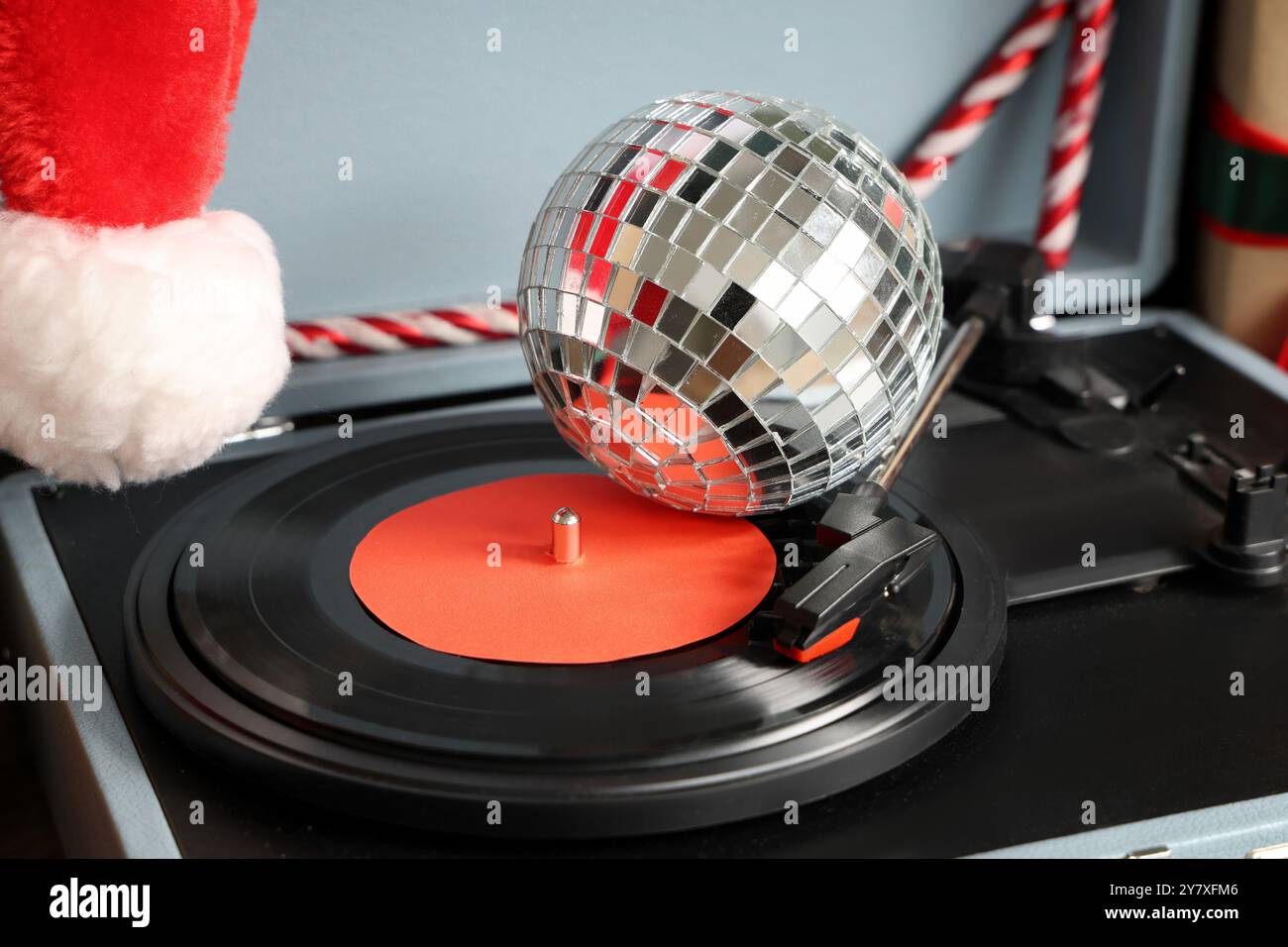 Vinyl record player with disco ball and candy canes, closeup Stock ...