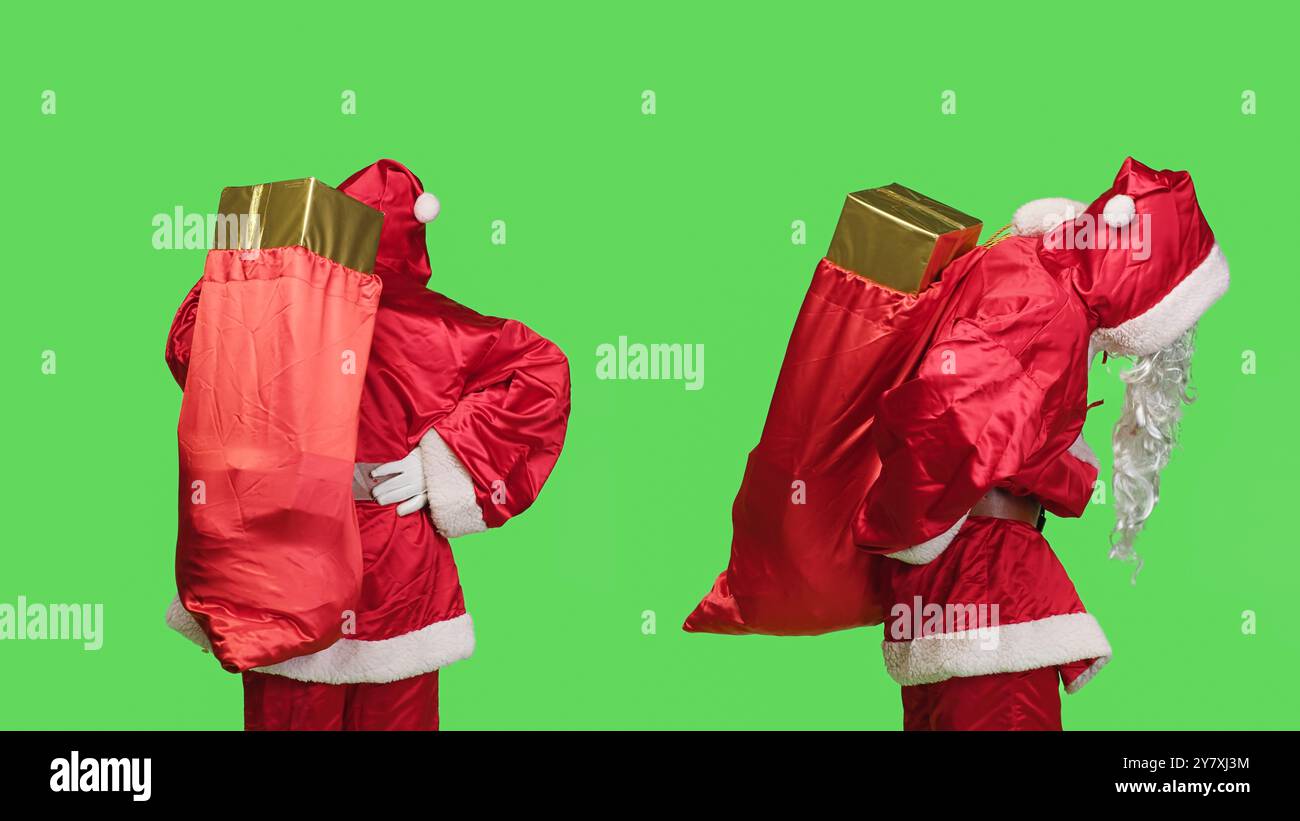 Father christmas ill with back pain feeling unwell while he is carrying ...