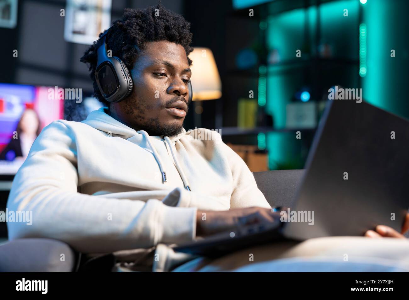 African american man relaxing at home by watching TV series on laptop ...