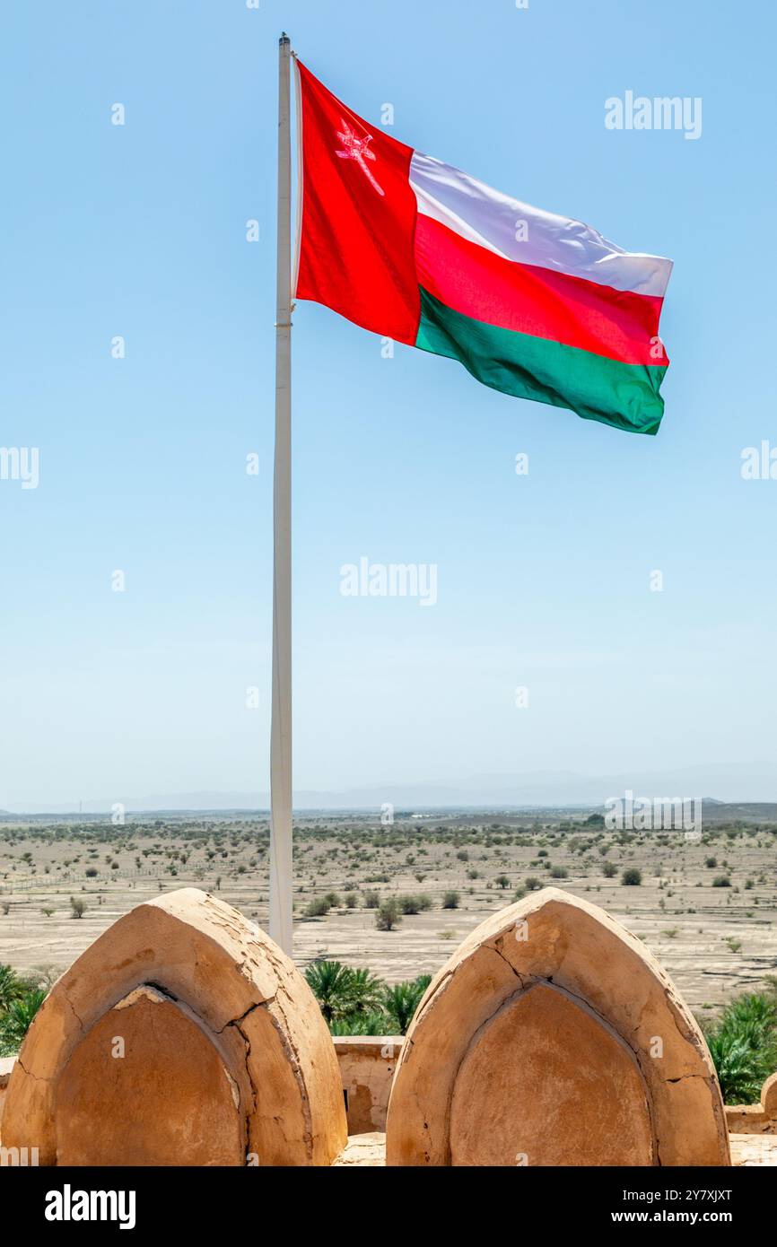 Omani flag waving in the wind view from Jabrin castle walls, Bahla ...