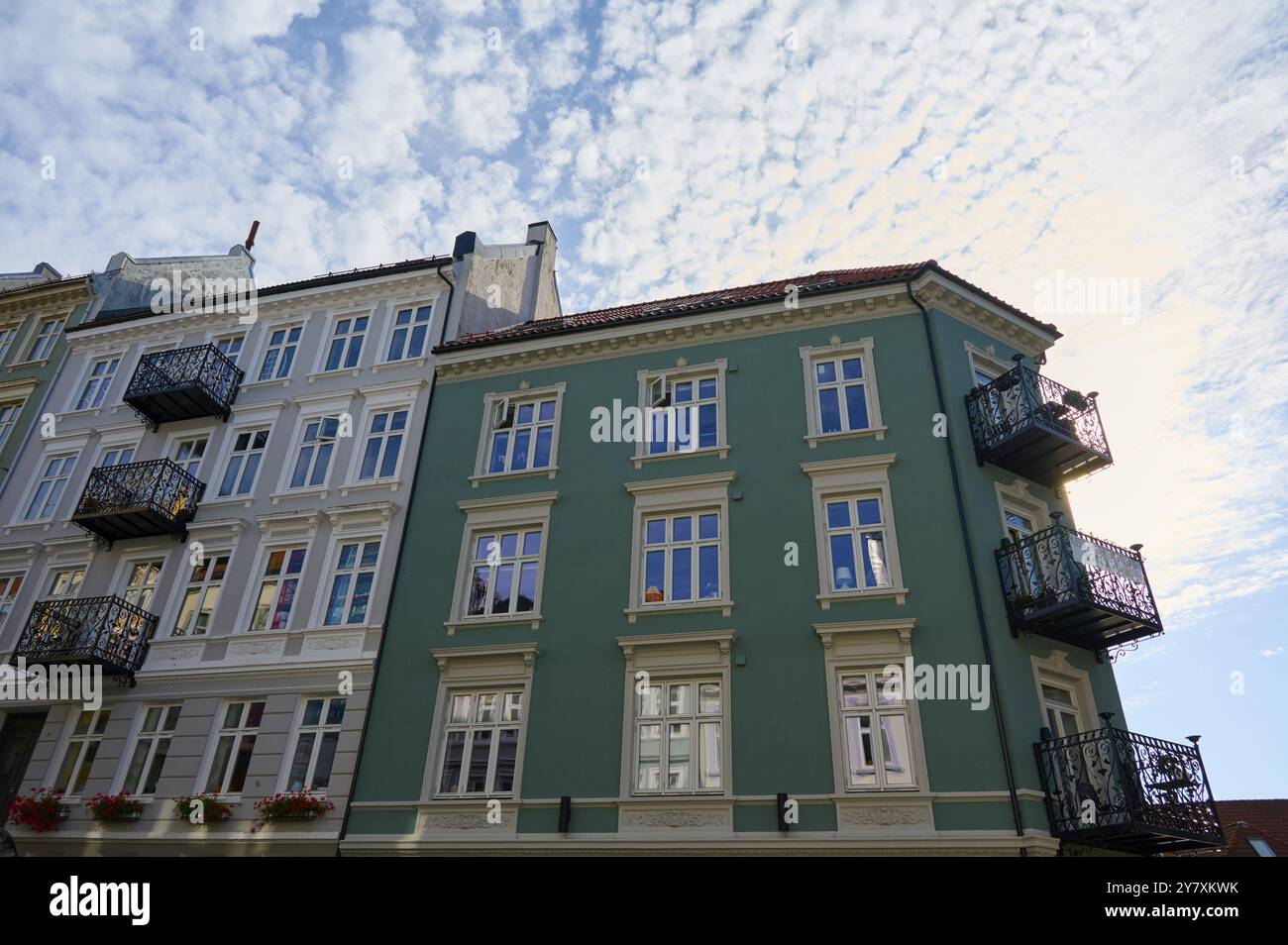 Multi-storey building with historic looking balconies and windows under ...