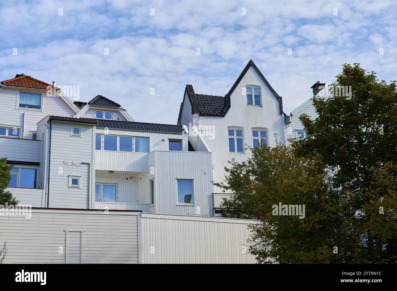 Building with white facade and white window frames under a blue sky ...