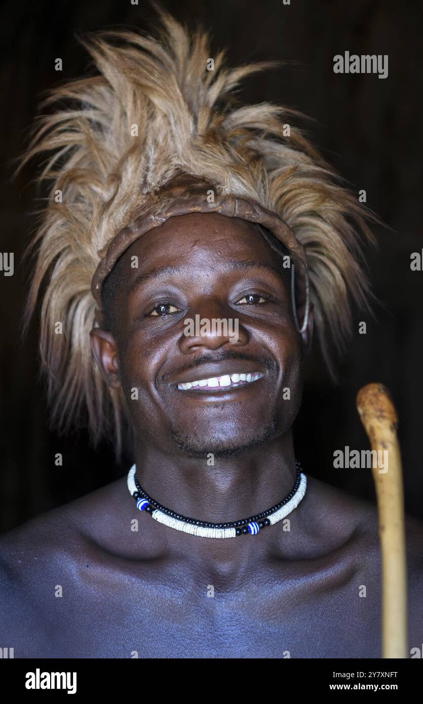 Young Himba man in his hut, Ohandungu, Kunene region, Kaokoveld ...