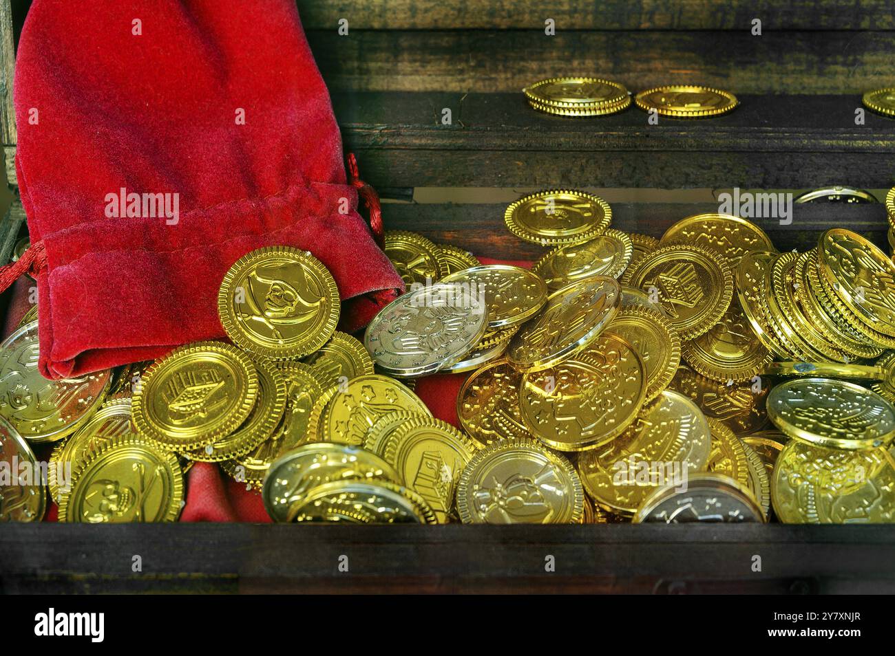 Shop window with decoration, treasure chest with gold and silver coins ...