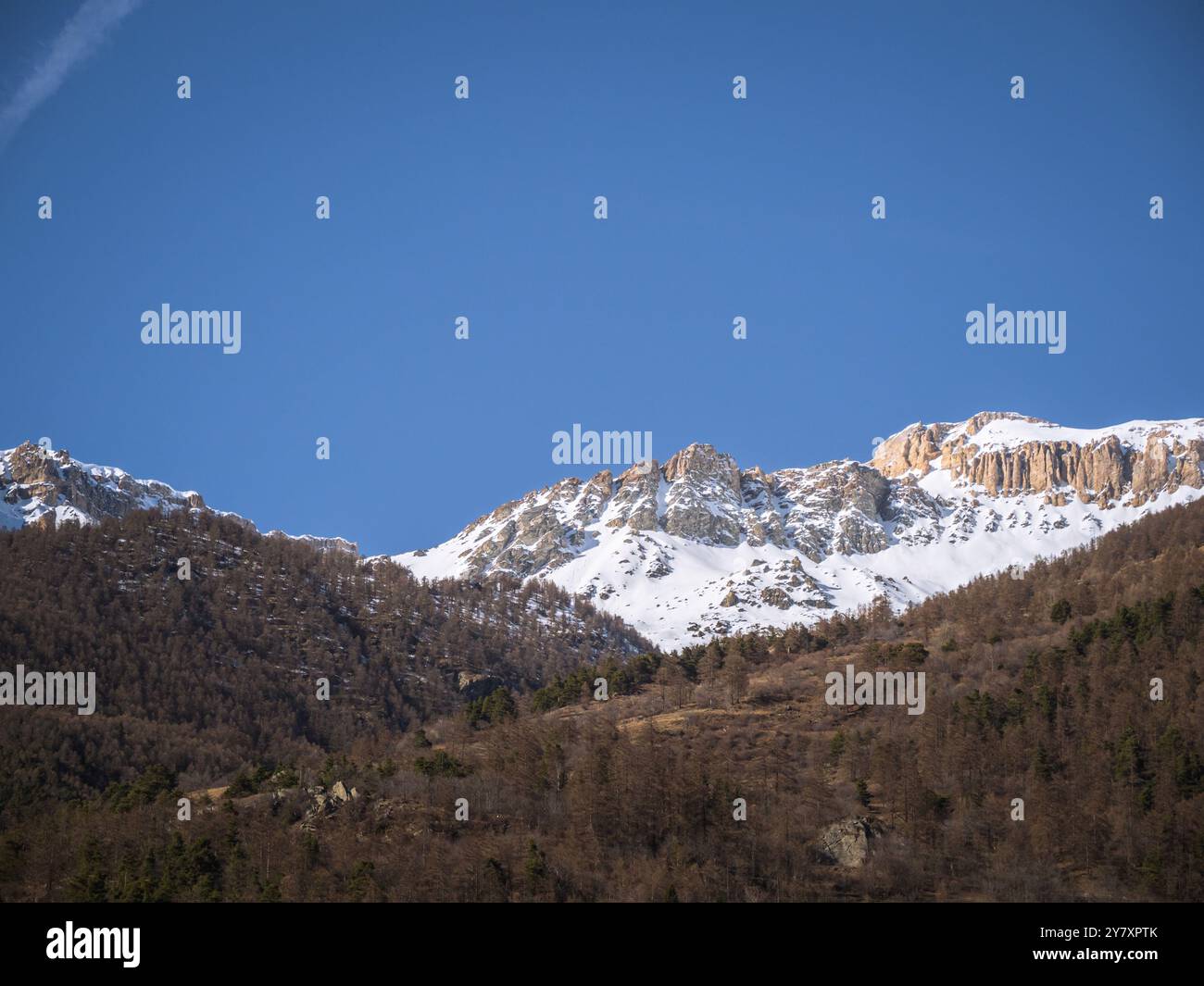 A stunning view of the snow-capped peaks of the Italian Alps under a ...