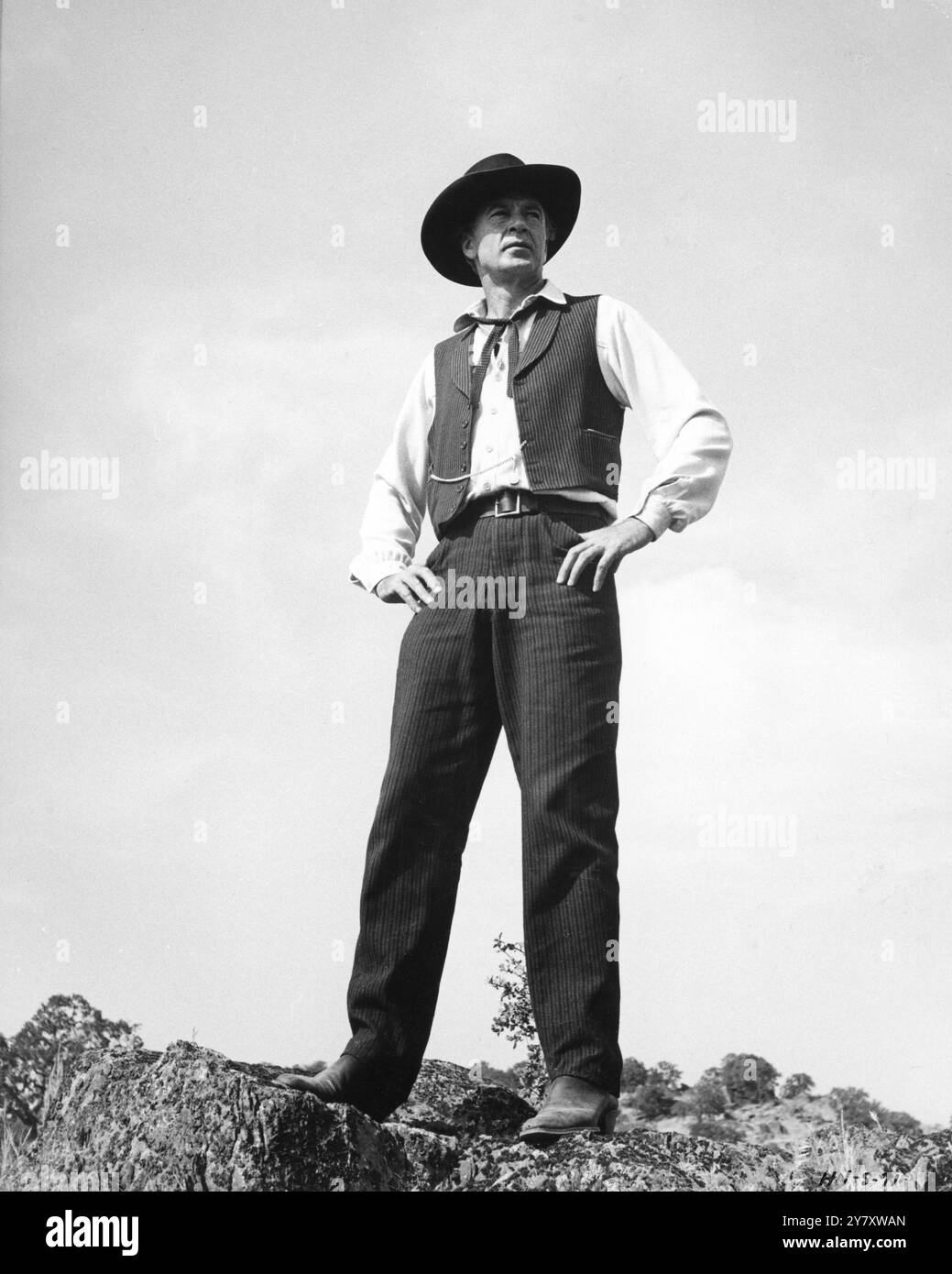 A candid photo of GARY COOPER in costume as Marshal Will Kane taken on ...