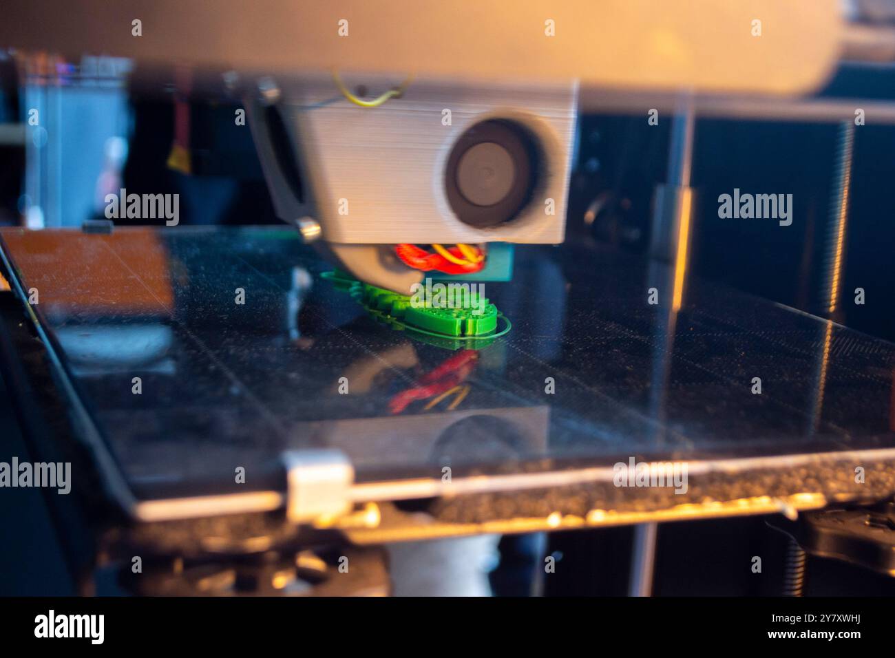 3D printer close up. A working 3D printer in process of printing object ...