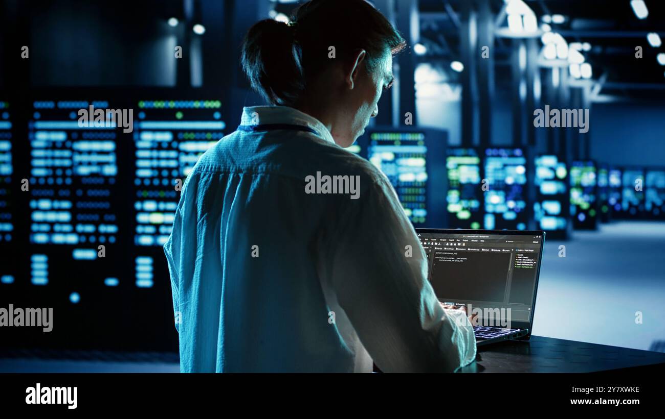 Experienced Engineer Running Programming Code On Laptop Troubleshooting And Updating Data