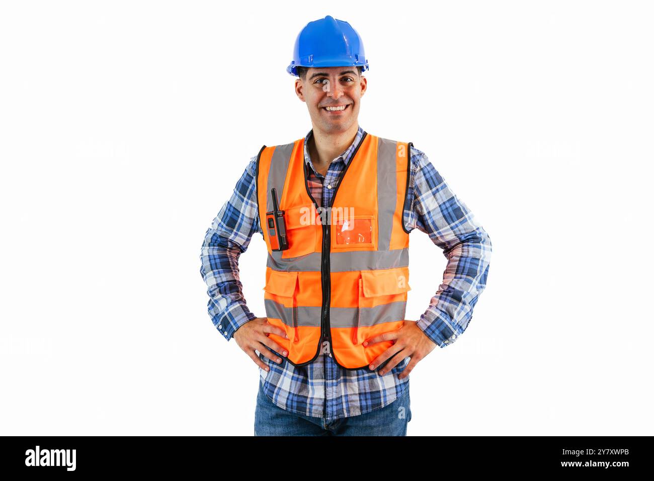 construction worker stands confidently with hands on hips, smiling at ...
