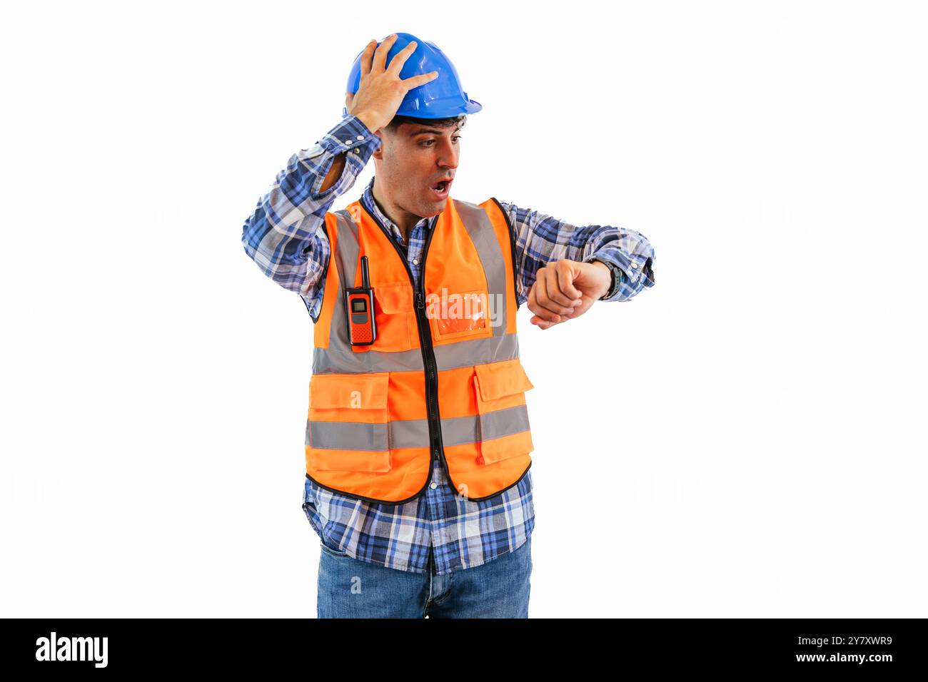 engineer, dressed in an orange reflective vest and a safety helmet, is ...