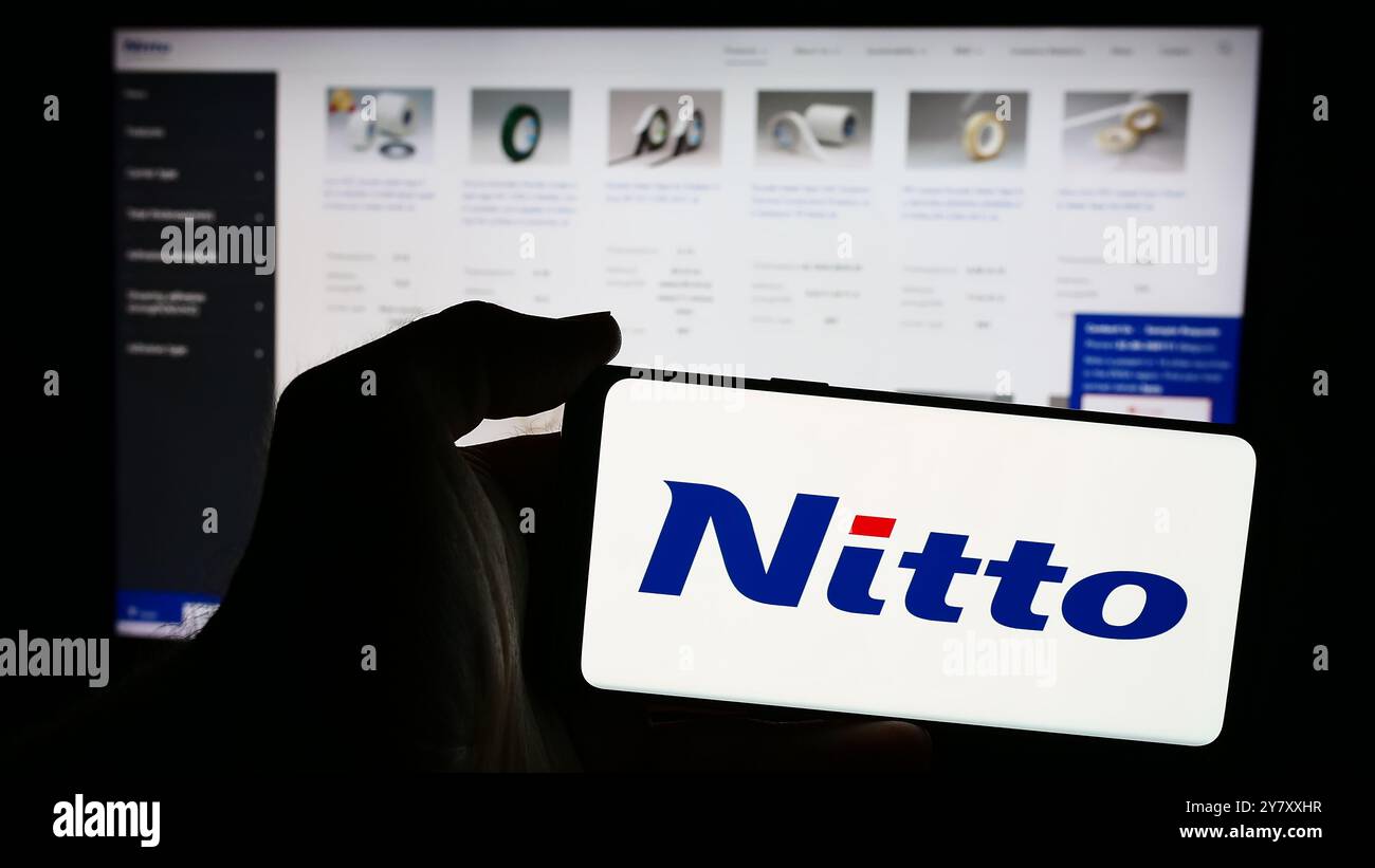 In this photo illustration, a person is holding a smartphone with the ...