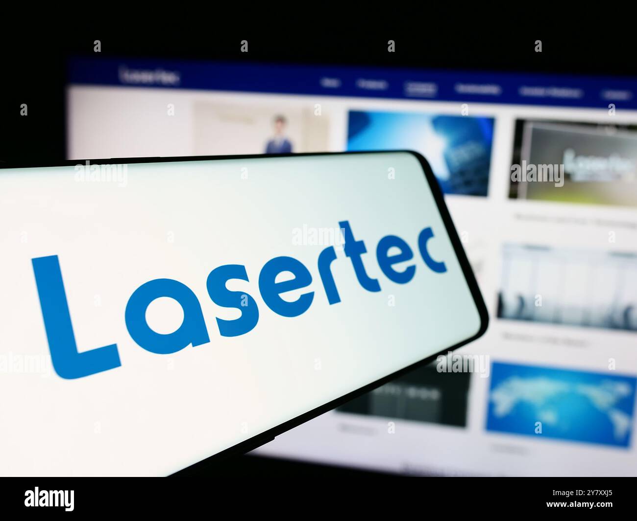 In this photo illustration, a mobile phone with the logo of Japanese ...