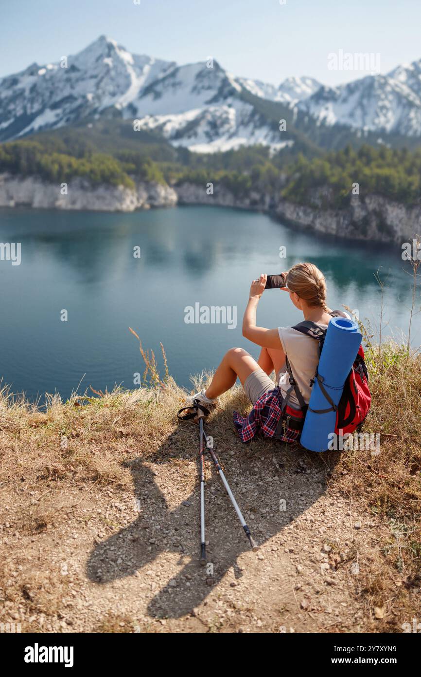 An Adventurous Photographer is Capturing a Scenic Mountain Lakeside ...