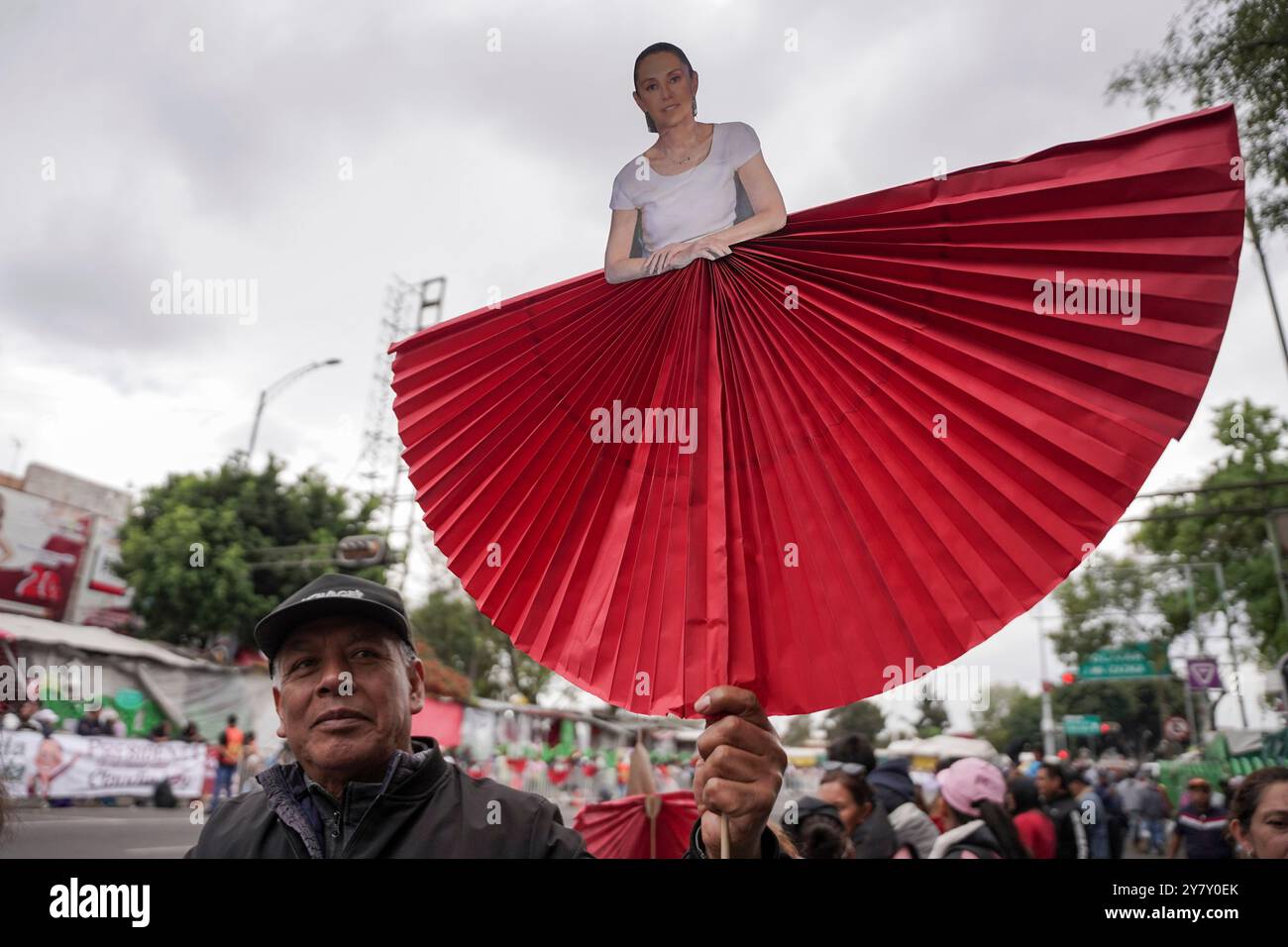 A supporter carries a cutout of President Claudia Sheinbaum during a ...