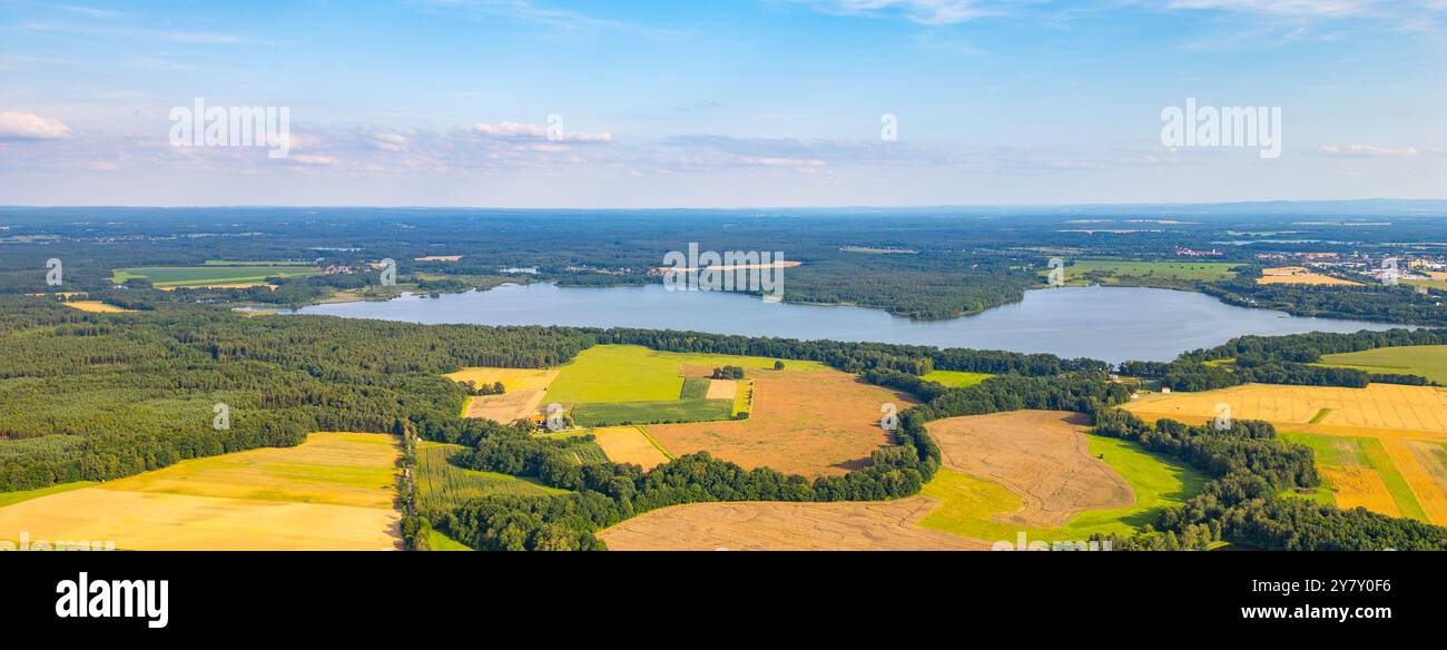 This peaceful landscape captures Rozmberk Pond surrounded by lush ...